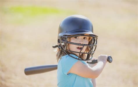 Little Blond Boy With A Expression On Face Holds A Baseball Bat Stock