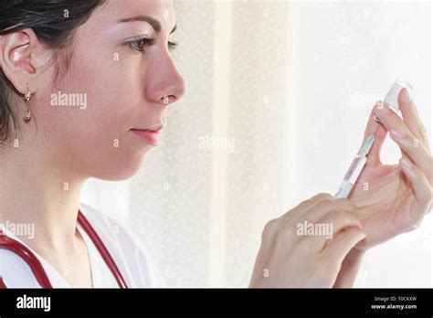 Female Doctor Preparing The Syringe For Injection Stock Photo Alamy