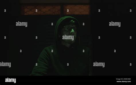 The Mysterious World Of A Hooded Glasses Wearing Computer Hacker At