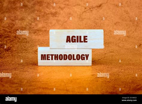 Wooden Blocks Display The Terms Agile And Methodology Against A Warm
