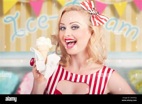 Attractive Retro Pinup Girl Eating Ice Cream Cone Inside A Vintage Ice