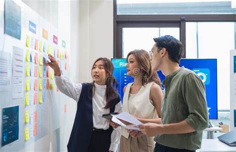 Brainstorming Session Using Sticky Notes On A Task Board Kanban To Organize Ideas And