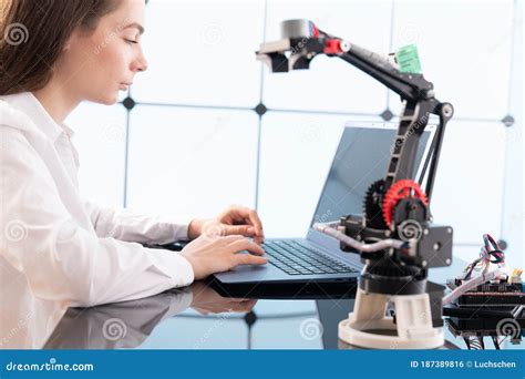 A Young Woman Writes An Algorithm For The Robot Arm Science Research