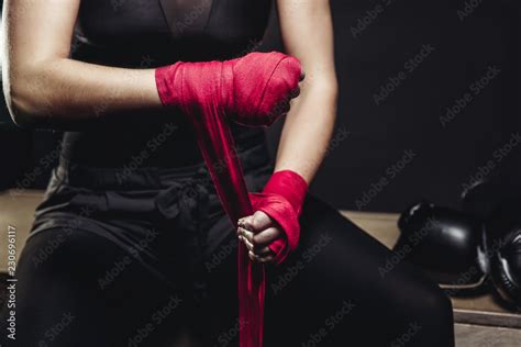 Woman Wraps Her Fists In Pink Bandages For Boxing Gloves Stock Photo Adobe Stock