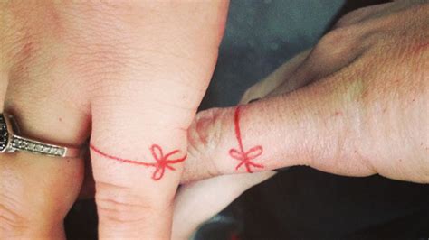 Red Thread Tattoo Meaning Symbolism Culture And Personal Significance