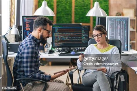 Software Programmers Analyzing Html Code And Database Brainstorming Script Ideas To Develop New