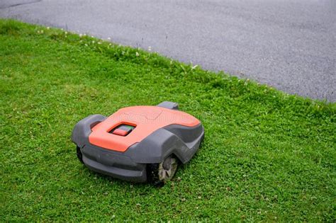 Robotic Lawn Mower On Green Grass Field Concept Of Modern Gardening Stock Image Image Of
