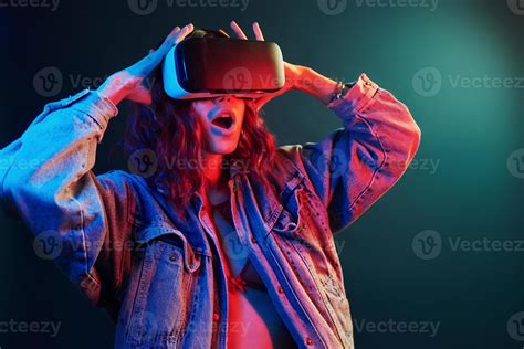 Facial Expression Of Young Girl With Virtual Reality Glasses On Head In
