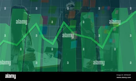 Collaborating Team Planning Project In Office With Sticky Notes On Partition Laptop And Data