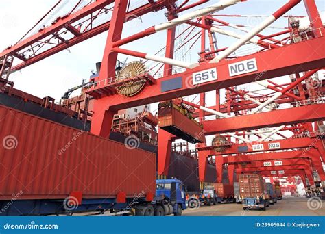 Berthing Container Heavy Cranes For Loading Multi Colored Containers Royalty Free Stock Image