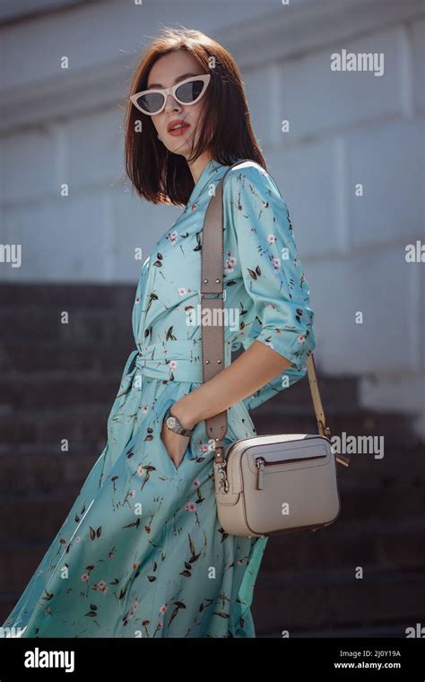 Fashion Portrait Of Young Stylish Woman Walking On The Street Wearing