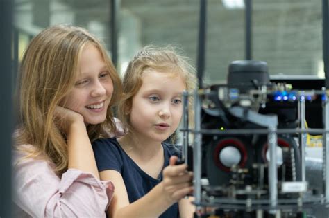 Free Stock Photo Of Two Girls Working With A Machine In A STEM Robotics Lab Download Free