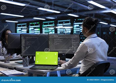 Workers In Server Room Checking Systems Bottlenecks Using Mockup