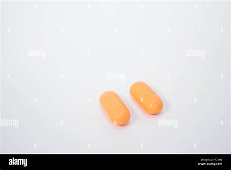 Two Orange Tablets Of Antibiotic Medication These Tablets Are Rifinah