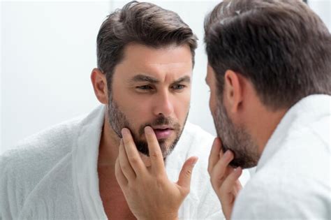 Premium Photo Sexy Sensual Man With Perfect Skin Touch Face After Shaving Skin Care Healthcare