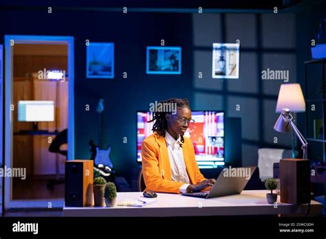 Worker Analyzing Data Charts On Laptop At Desk Interpreting