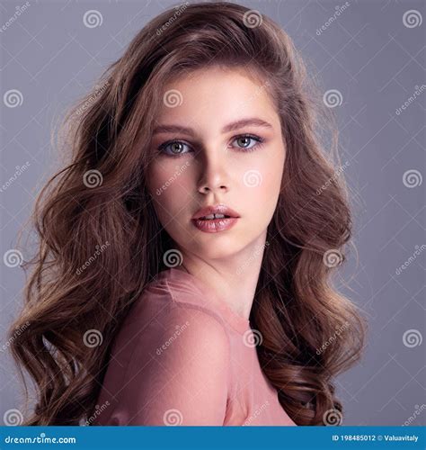 Beautiful Brown Hair Girl With Long Wavy Hair Young Girl Posing In
