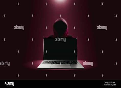 Crime And Attack Technology Concept By Hacker Grey Laptop With Black Blank Screen And Red