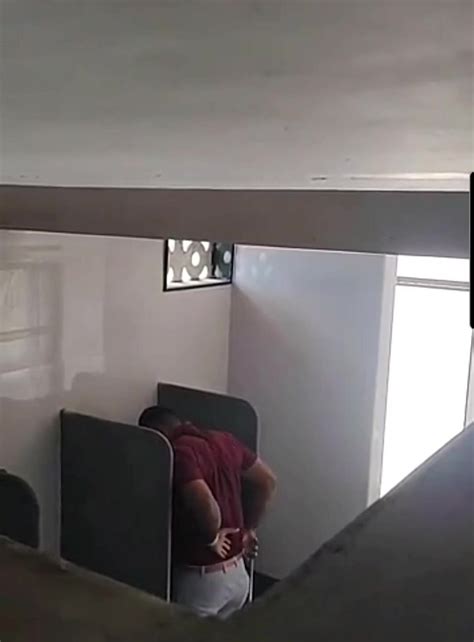 Handsome Indian Man Pissing In Urinal