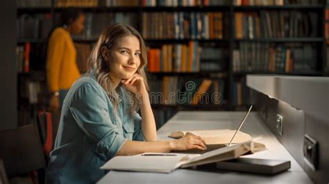 University Library Focused Bright Caucasian Girl Works On Assignment Use Computer Looking At