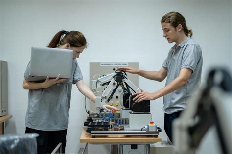 Trainee Robotics Engineer Learning With Programming And Manipulating