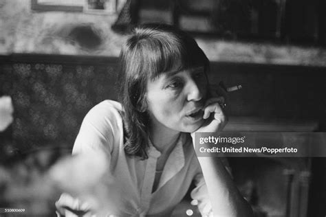 English Author Beryl Bainbridge Pictured Sitting In A House In London