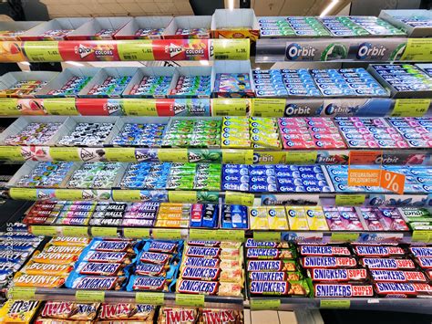 Minsk Belarus Oct 10 2022 Various Candies Chewing Gum Chocolate Bars On The Store Shelf In