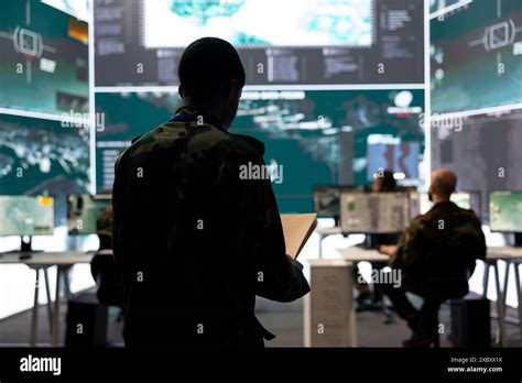 Infantry Unit Soldier Overseeing Intelligence Gathering Activity In Military Command Center