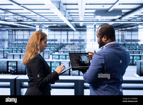 Teamworking Colleagues Using Ai Software On Laptop Programming In Ai