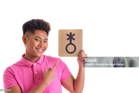 Gender Nonbinary Asian Person Pointing To A Sign With Gender Queer