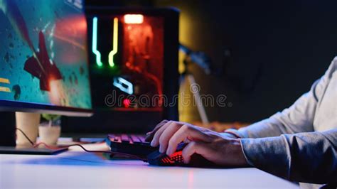 Man Using Gaming Rgb Lit Mouse To Shoot Asteroids In Spaceship Flying Videogame Stock Image