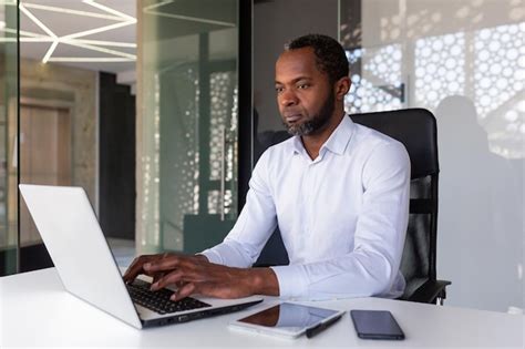 Premium Photo Serious Focused African American Programmer Working Inside Office Man Coding New