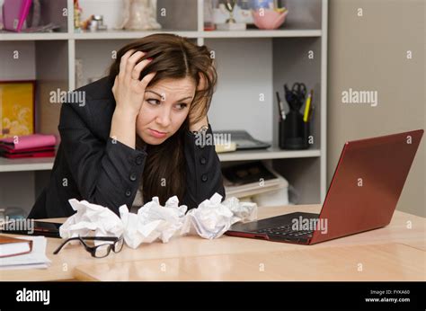 The Girl At Computer With A Bunch Of Crumpled Sheets Paper Stock Photo Alamy