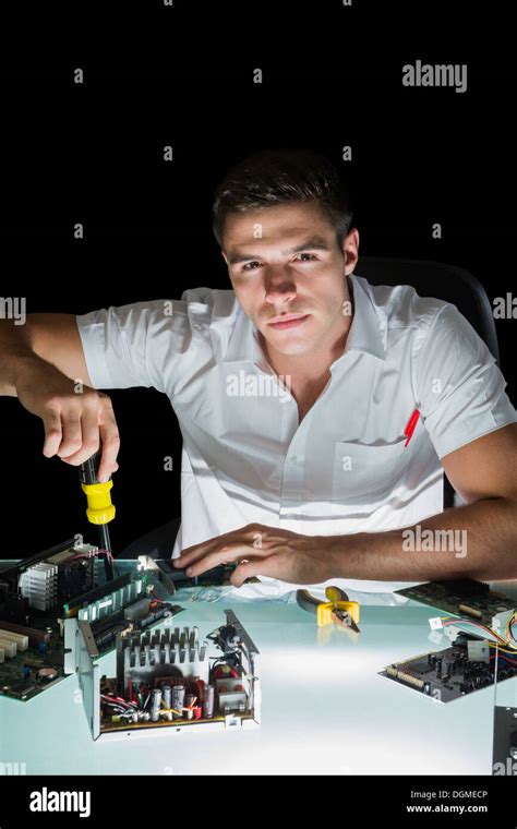 Attractive Computer Engineer Working By Night With Screw Driver Stock Photo Alamy