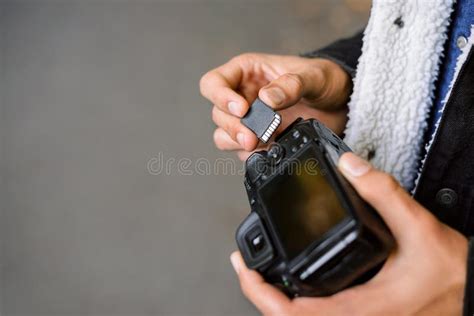 Photographer Inserting Sd Memory Card Stock Image Image Of Electronic Safety