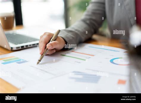 Business Analyst Concept The Data Analyst Calculating The Diagrams About The Sale On The