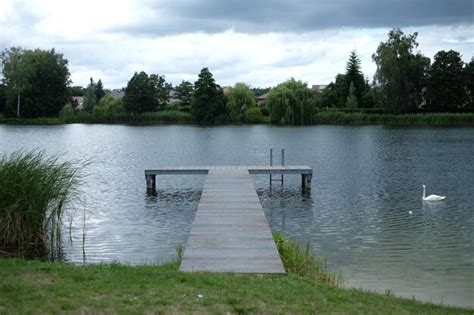 Premium Photo Empty Jetty At Lake Against Cloudy Sky