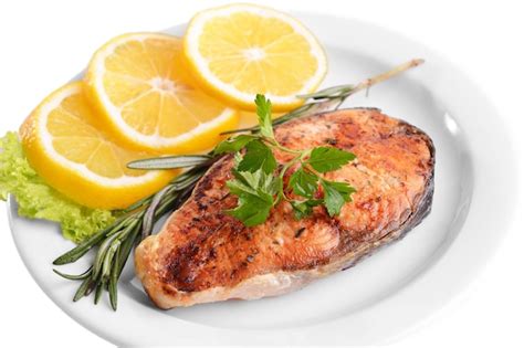 Premium Photo Tasty Baked Fish On Plate Isolated On White