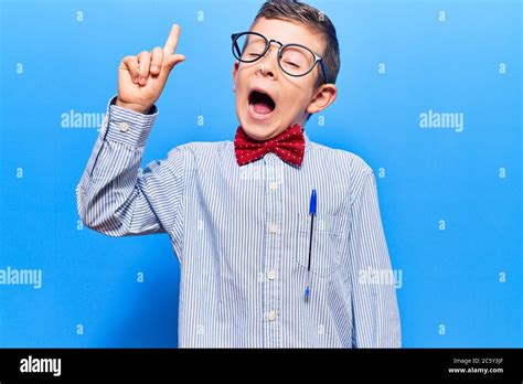 Cute Blond Kid Wearing Nerd Bow Tie And Glasses Pointing Finger Up With Successful Idea Exited