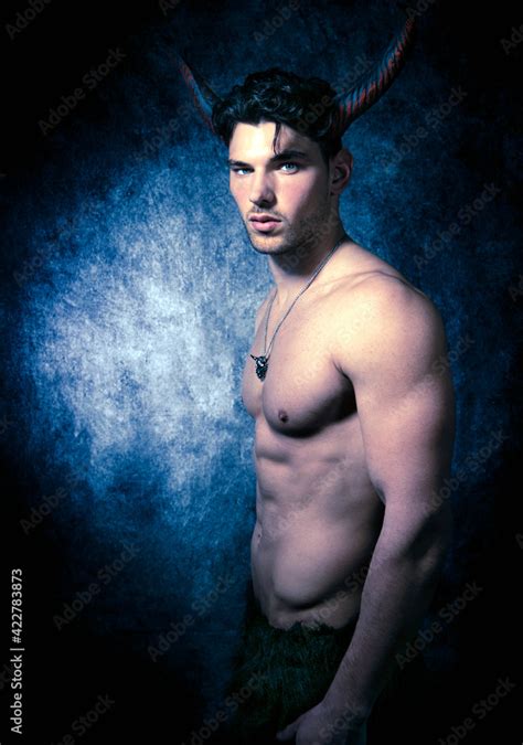 Sexy Shirtless Male Devil With Horns And Muscular Body Showing Pecs And