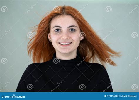 Close Up Portrait Of Pretty Redhead Girl With Long Wavy Hair Blowing On