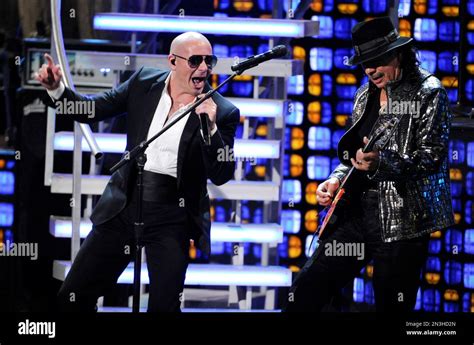 Pitbull Left And Carlos Santana Perform At The 15th Annual Latin