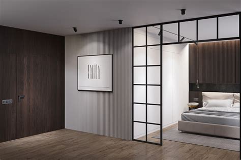 회색 벽에 조명 된 수평 포스터가있는 어두운 미니멀리스트 인테리어 내장 된 나무 문 밝은 현대 침대 헤드 보드 위에 어두운 나무 사물함이있는 금속 침실 파티션 0명에 대한