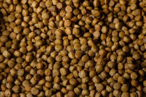 Pet Food Pellets Scattered Across A Surface Showcasing Their Rich