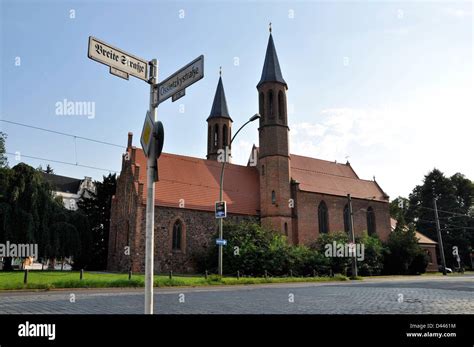 A Road Sign Showing The Name Of The Street Breite Strasse In Old