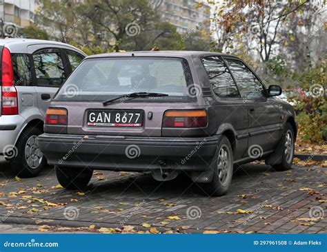 Old Metal Brown Small Youngtimer Toyota Corolla Compact Two Door Parked