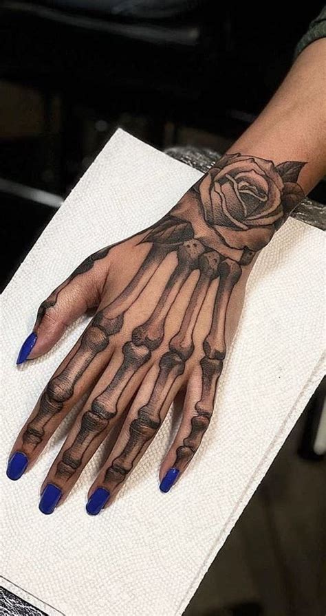 100 Skeleton Hand Tattoos And Meanings Skeleton Hand Tattoo Skull Hand