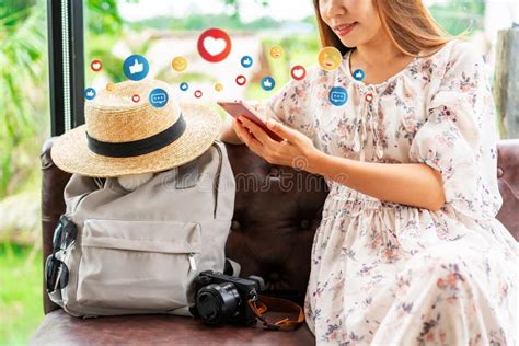 Young Woman Using Mobile Phone With Social Media Interactions And Notification Icons While