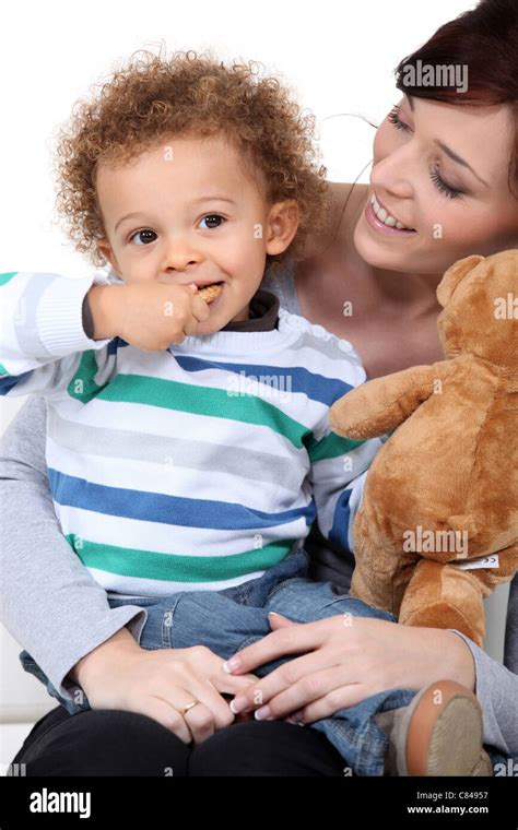 Mother Hugging Her Son Stock Photo Alamy
