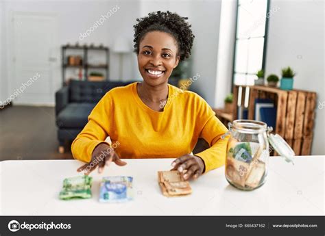 African American Woman Sitting Table Pulling Apart Rand Banknotes Home